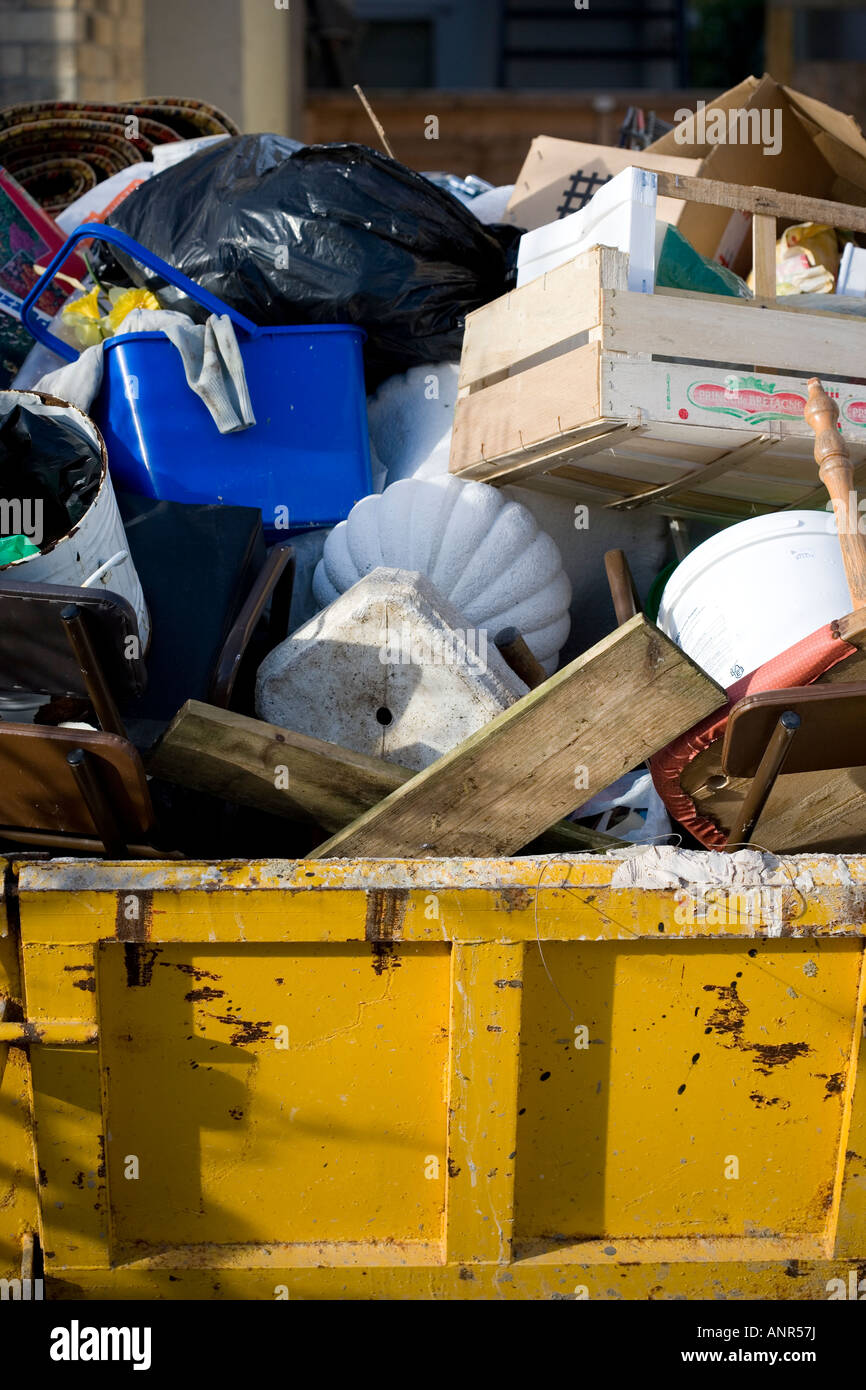 Skip filled with rubbish Stock Photo - Alamy