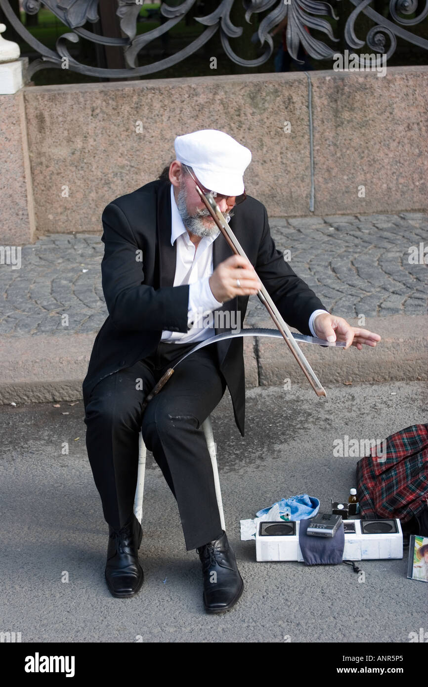 Man playing saw hi-res stock photography and images - Alamy