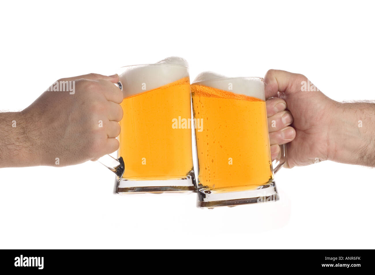Two people making a toast with beer mugs Stock Photo - Alamy