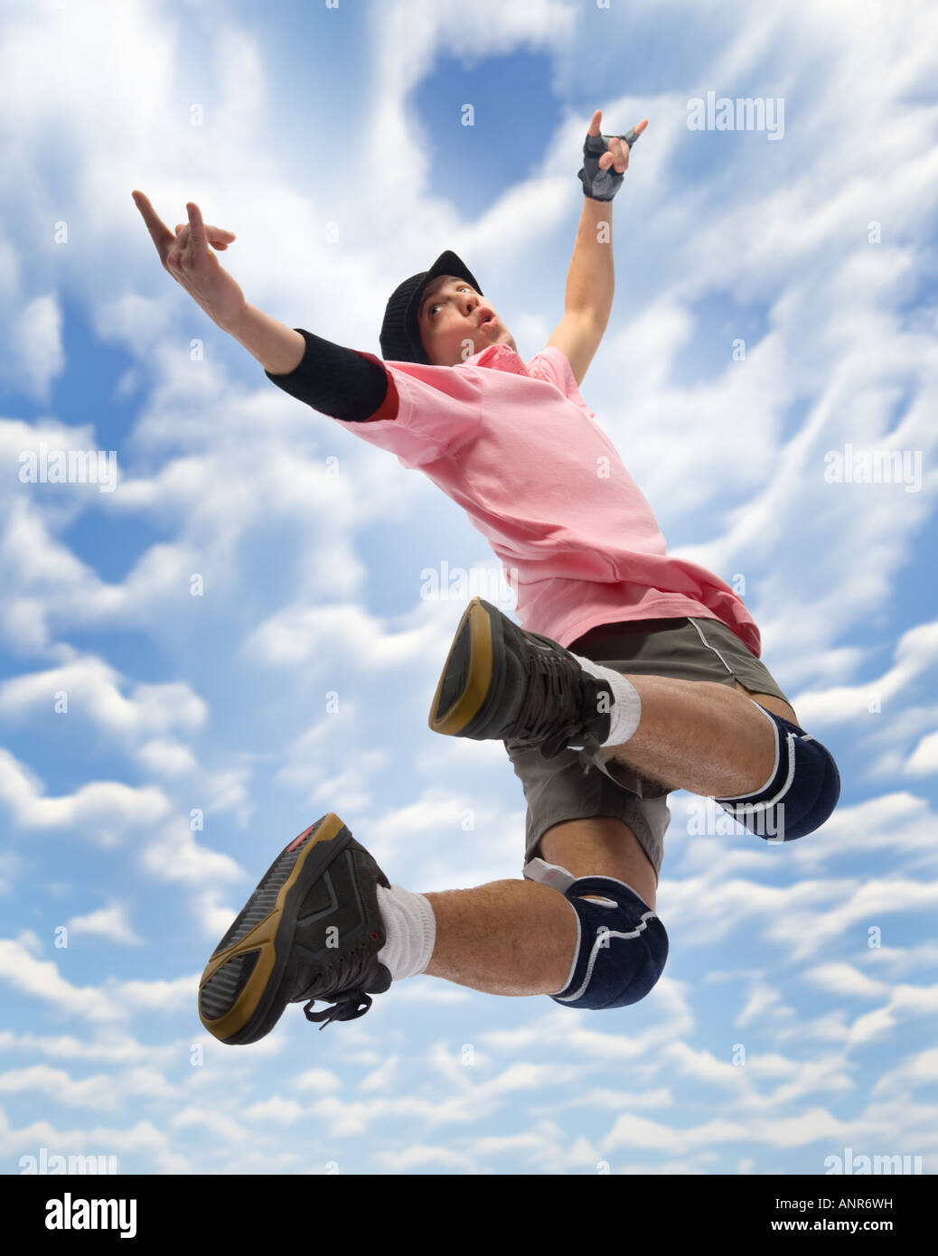 Young surprised and looks like falling bboy in cap Looking at camera ...
