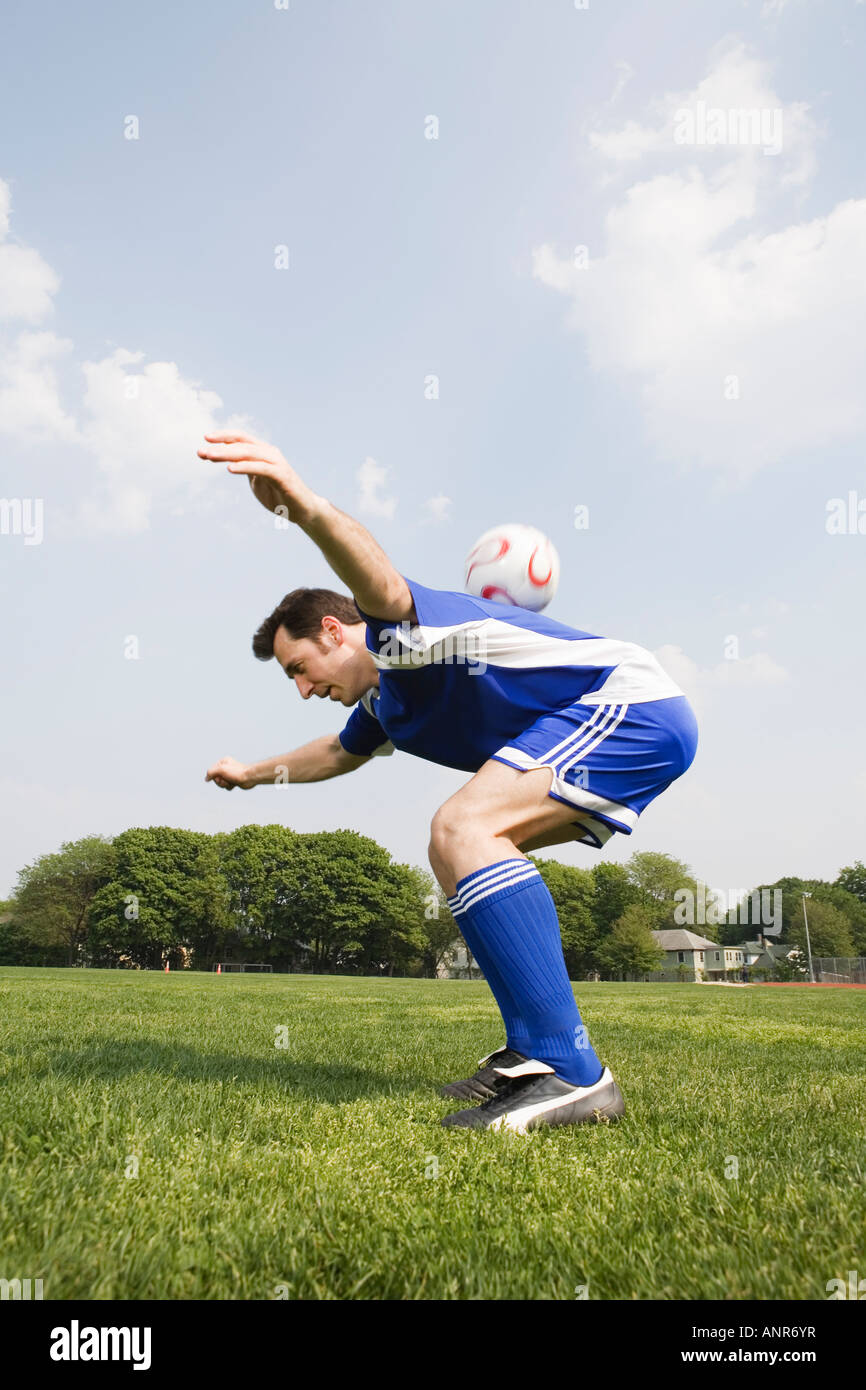 Football player handling ball hi-res stock photography and images - Alamy