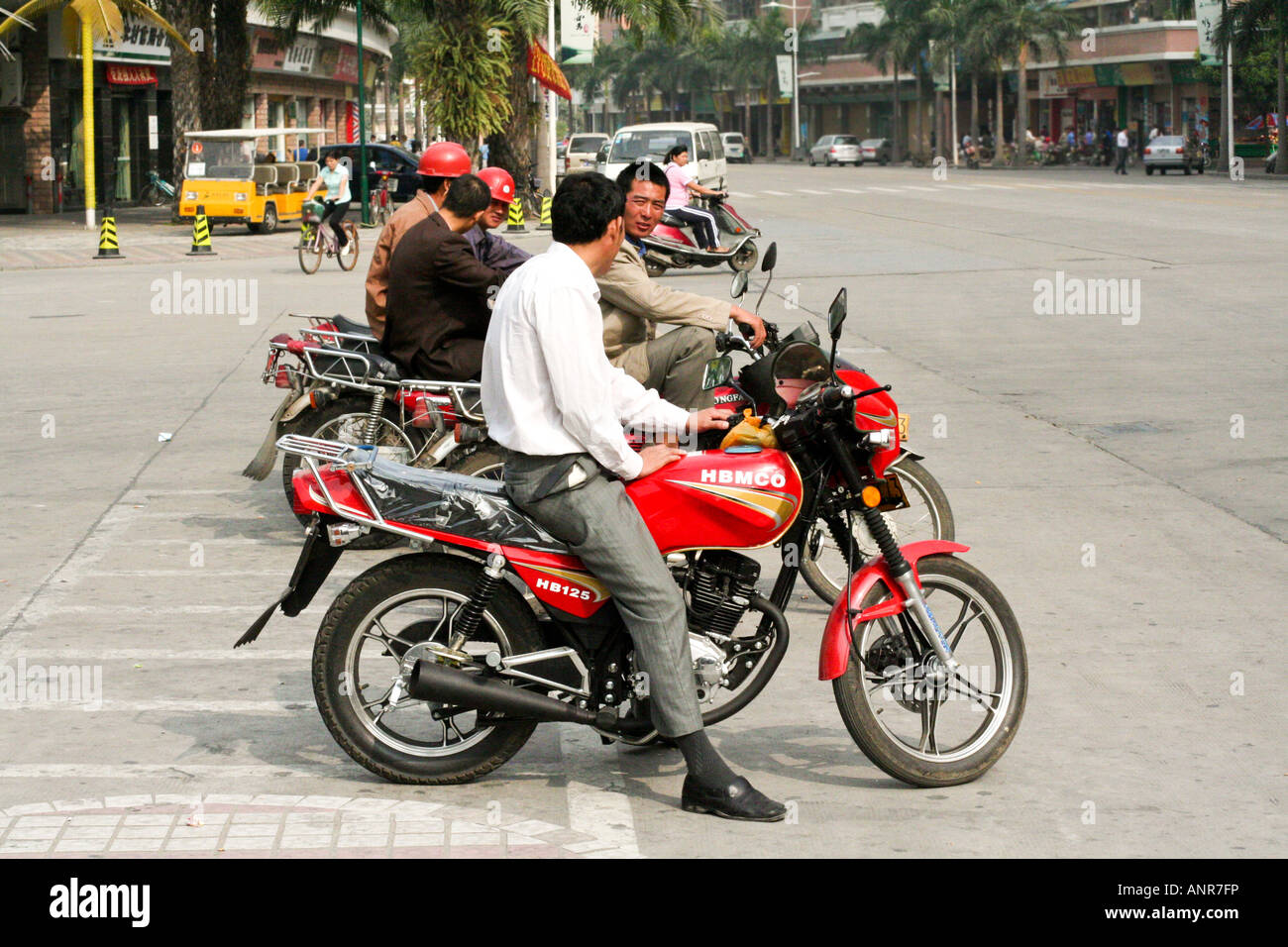 Motorcycle taxis in Guangzhou China Stock Photo - Alamy