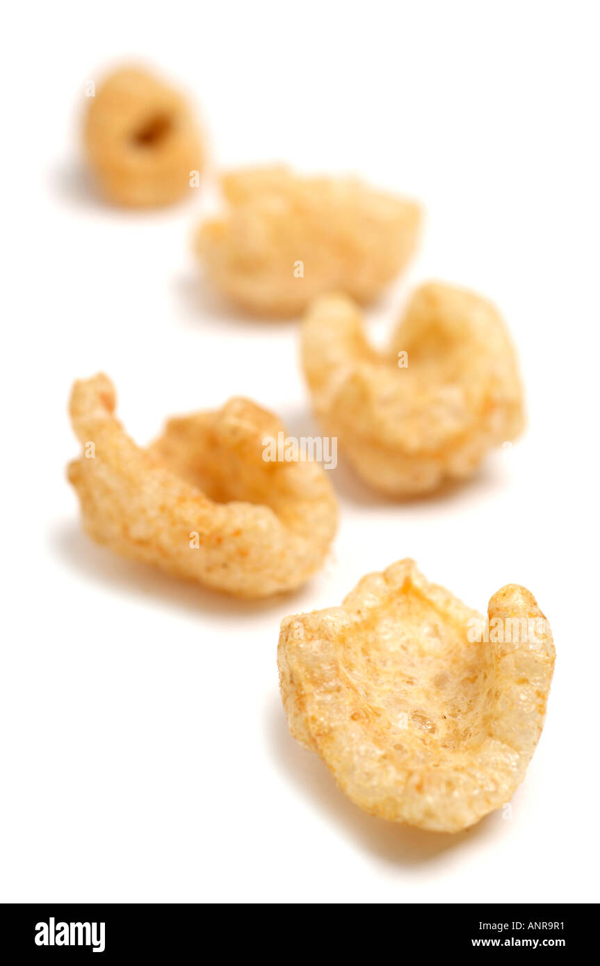 Pork scratchings on white background Stock Photo - Alamy