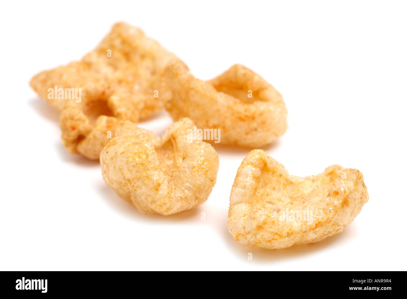 Pork scratchings on white background Stock Photo - Alamy