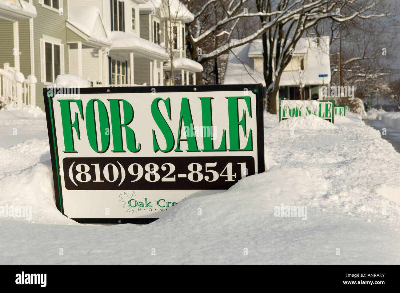 For Sales signs in snow at new homes in Port Huron Michigan USA Stock ...