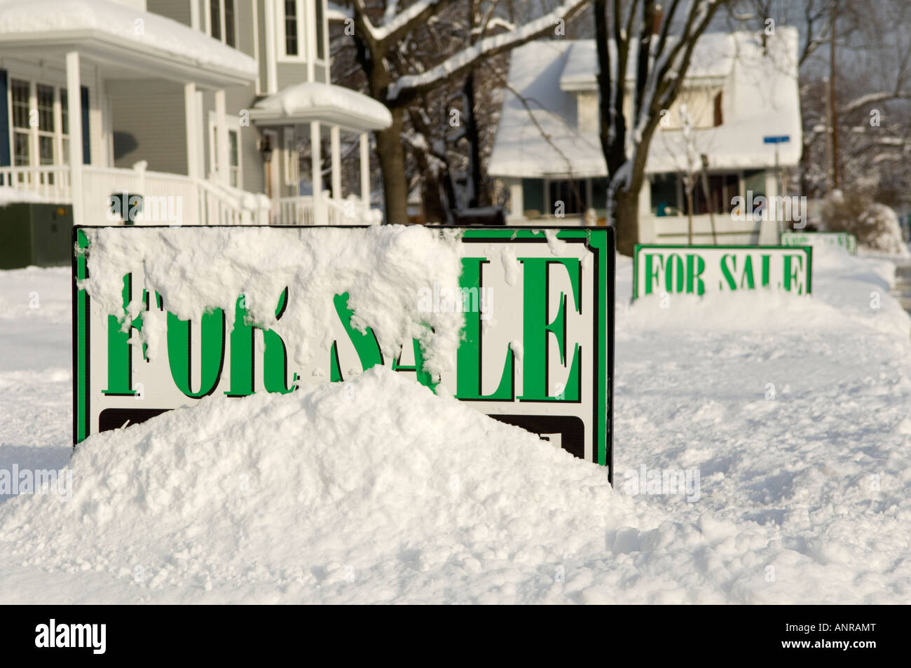 For Sales signs in snow at new homes in Port Huron Michigan USA Stock ...
