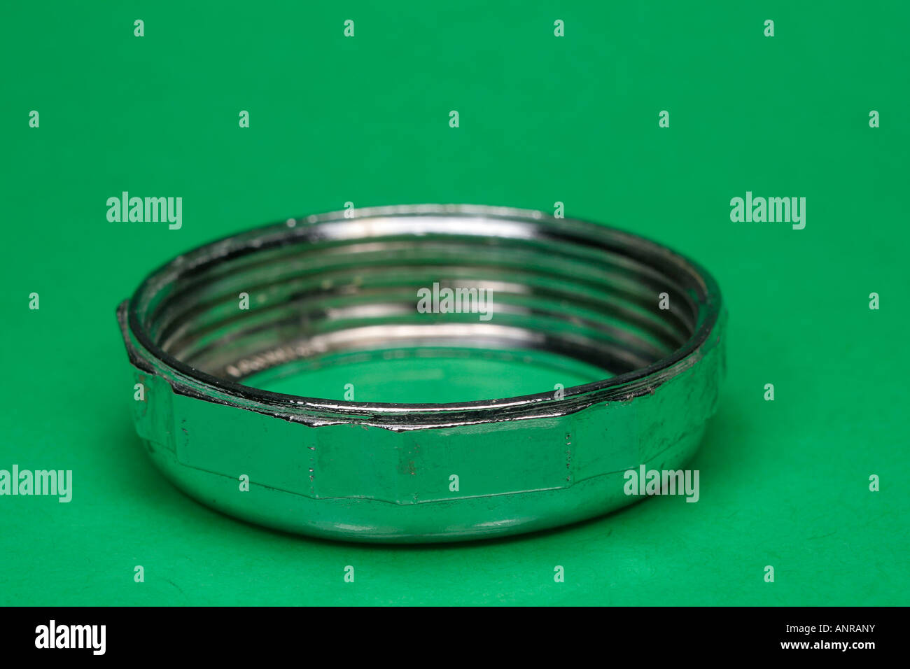 Metal nut used to connect a drain Stock Photo - Alamy