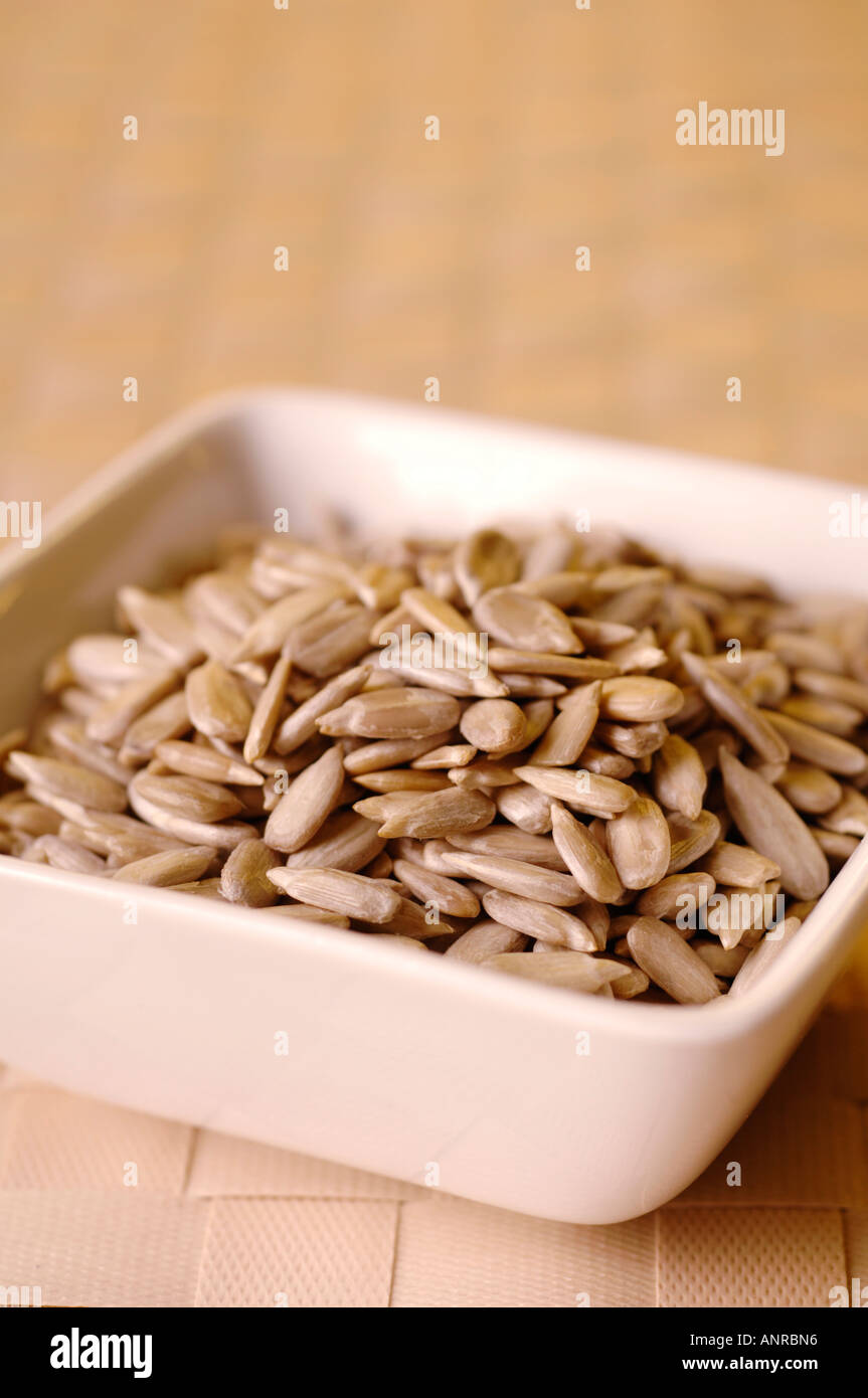 Sunflower seeds in small white dish Stock Photo - Alamy