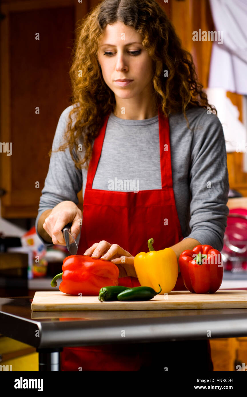 Woman cutting fresh peppers Stock Photo - Alamy