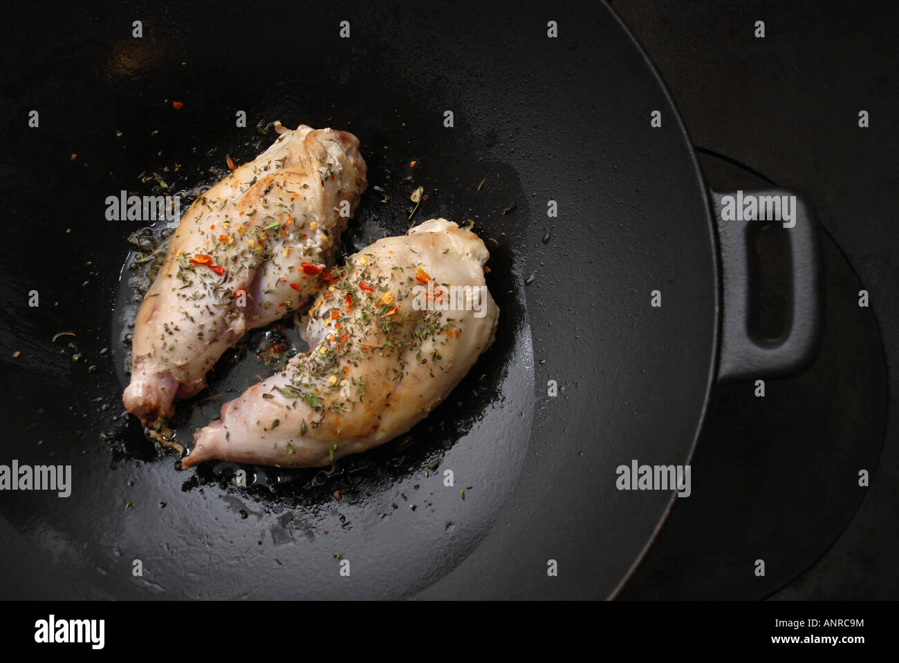 Rabbit roast in oil and herbs Stock Photo - Alamy