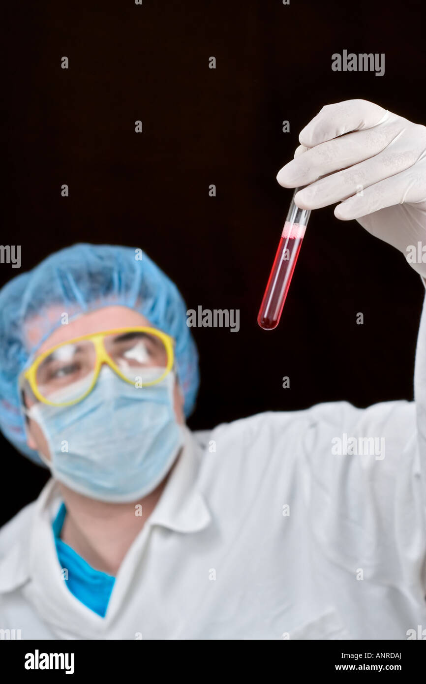 Medical technician examining blood samples Stock Photo - Alamy
