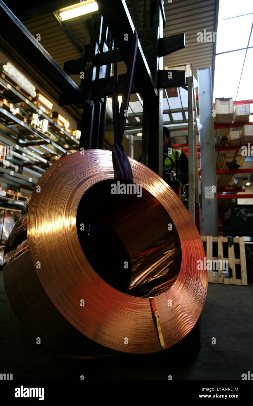 Copper Stripping Coil in a copper distribution centre Stock Photo - Alamy