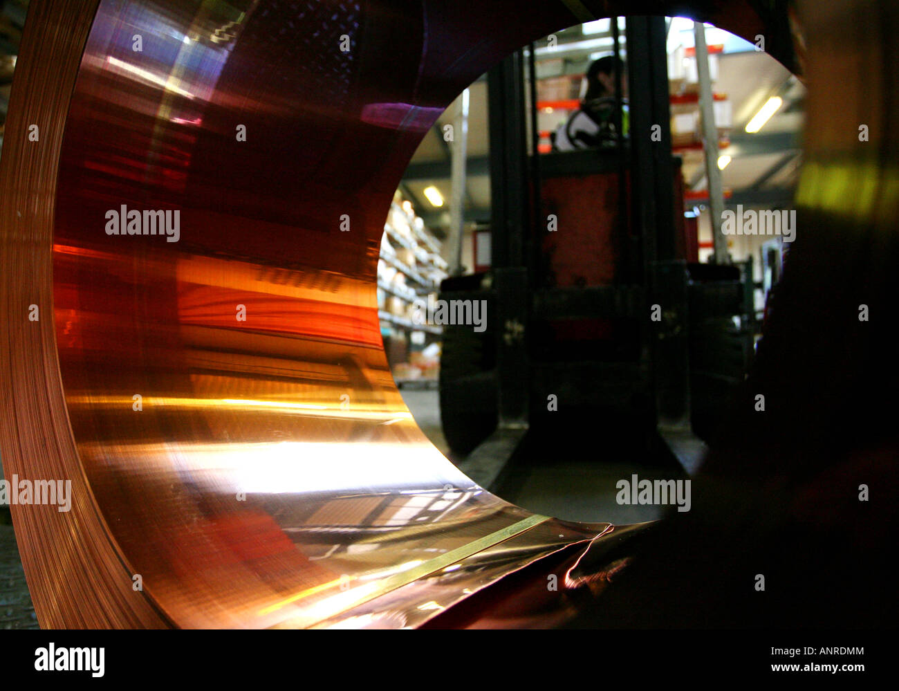 Copper Stripping Coil in a copper distribution centre Stock Photo - Alamy