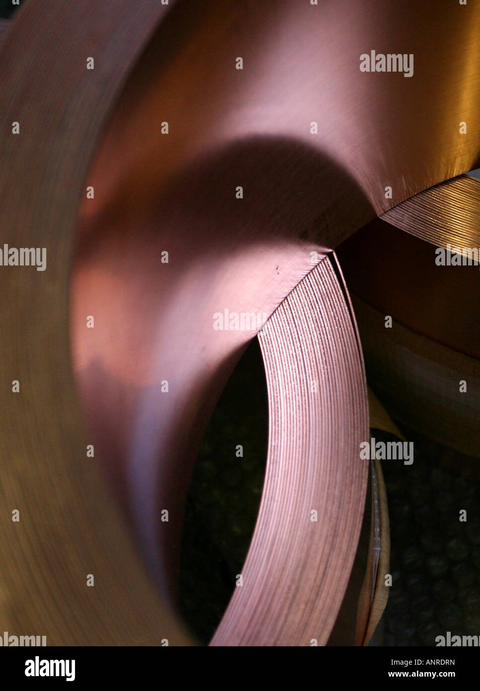 Copper Stripping Coil in a copper distribution centre Stock Photo - Alamy