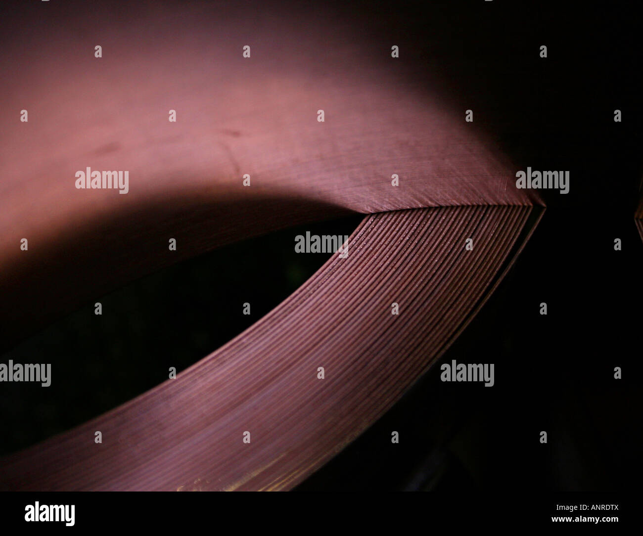 Copper Stripping Coil in a copper distribution centre Stock Photo - Alamy