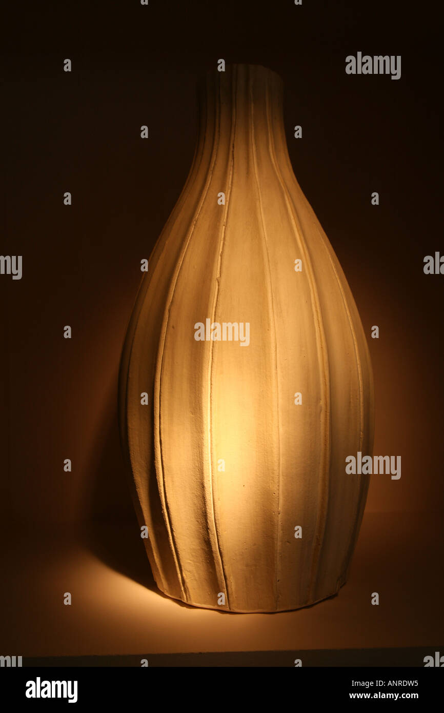 ceramic vase under a spot light Stock Photo - Alamy