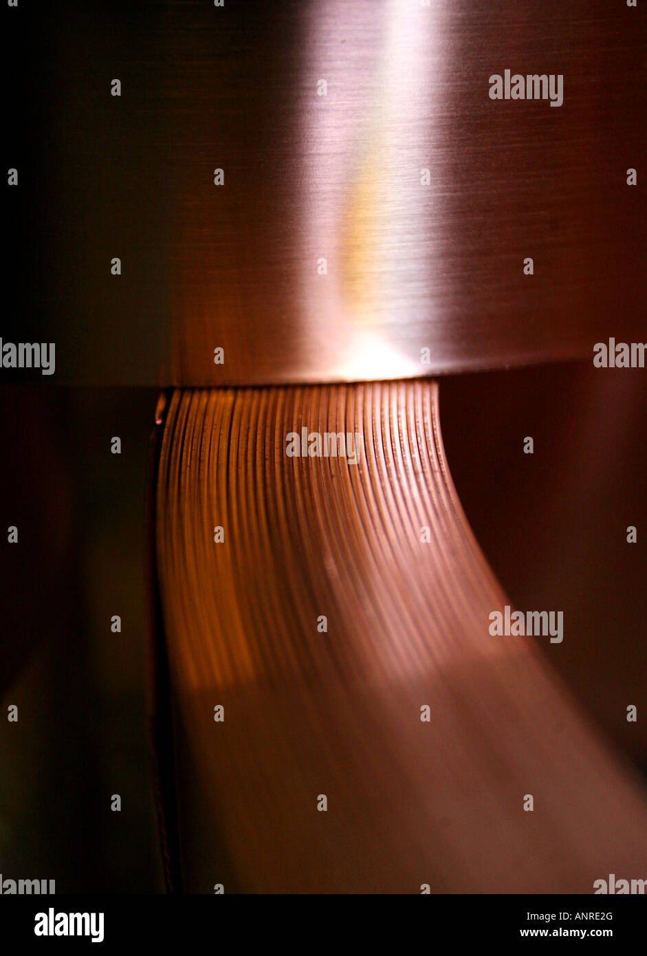 Copper Stripping Coil in a copper distribution centre Stock Photo - Alamy