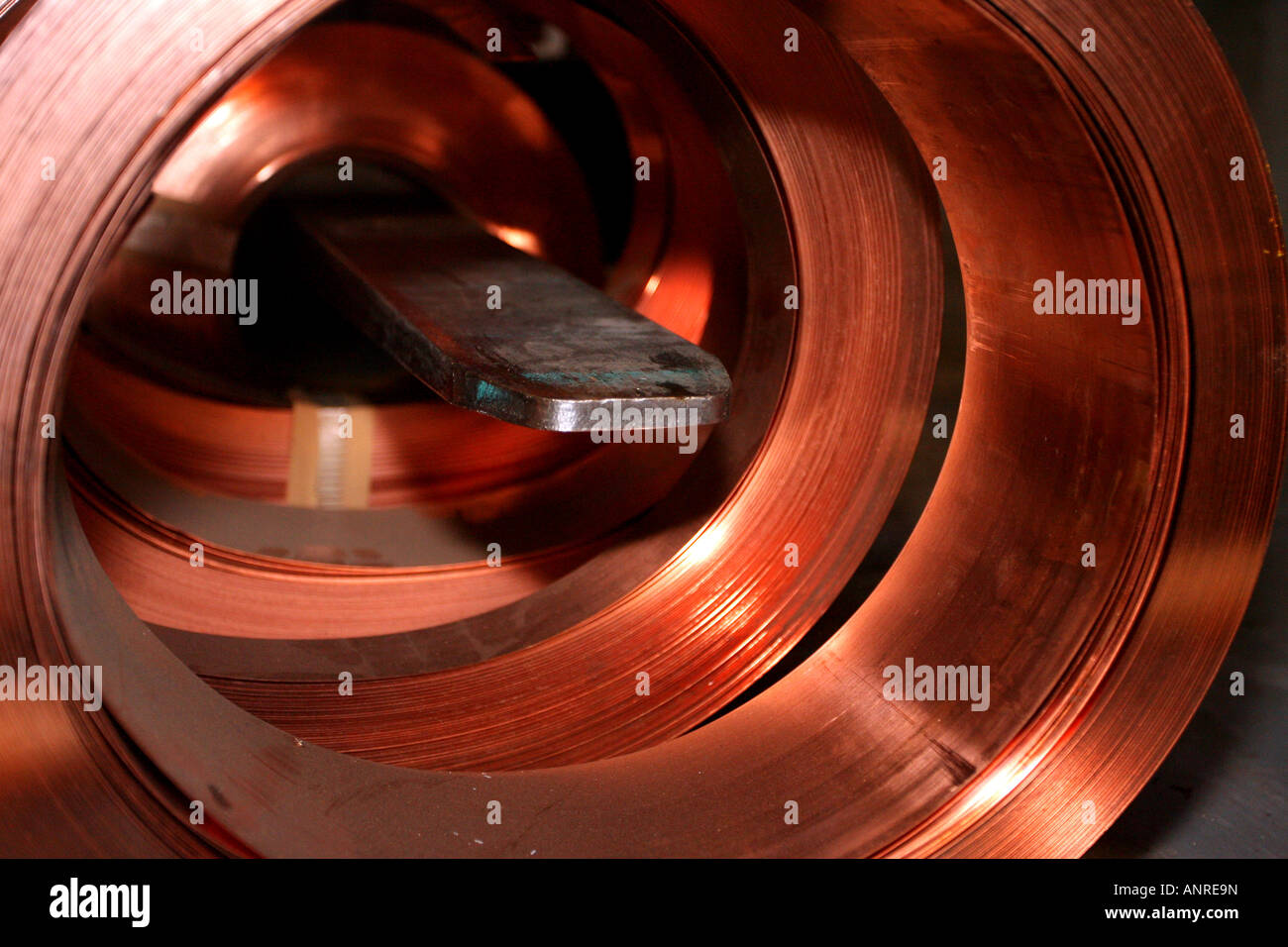 Copper Stripping Coil in a copper distribution centre Stock Photo - Alamy