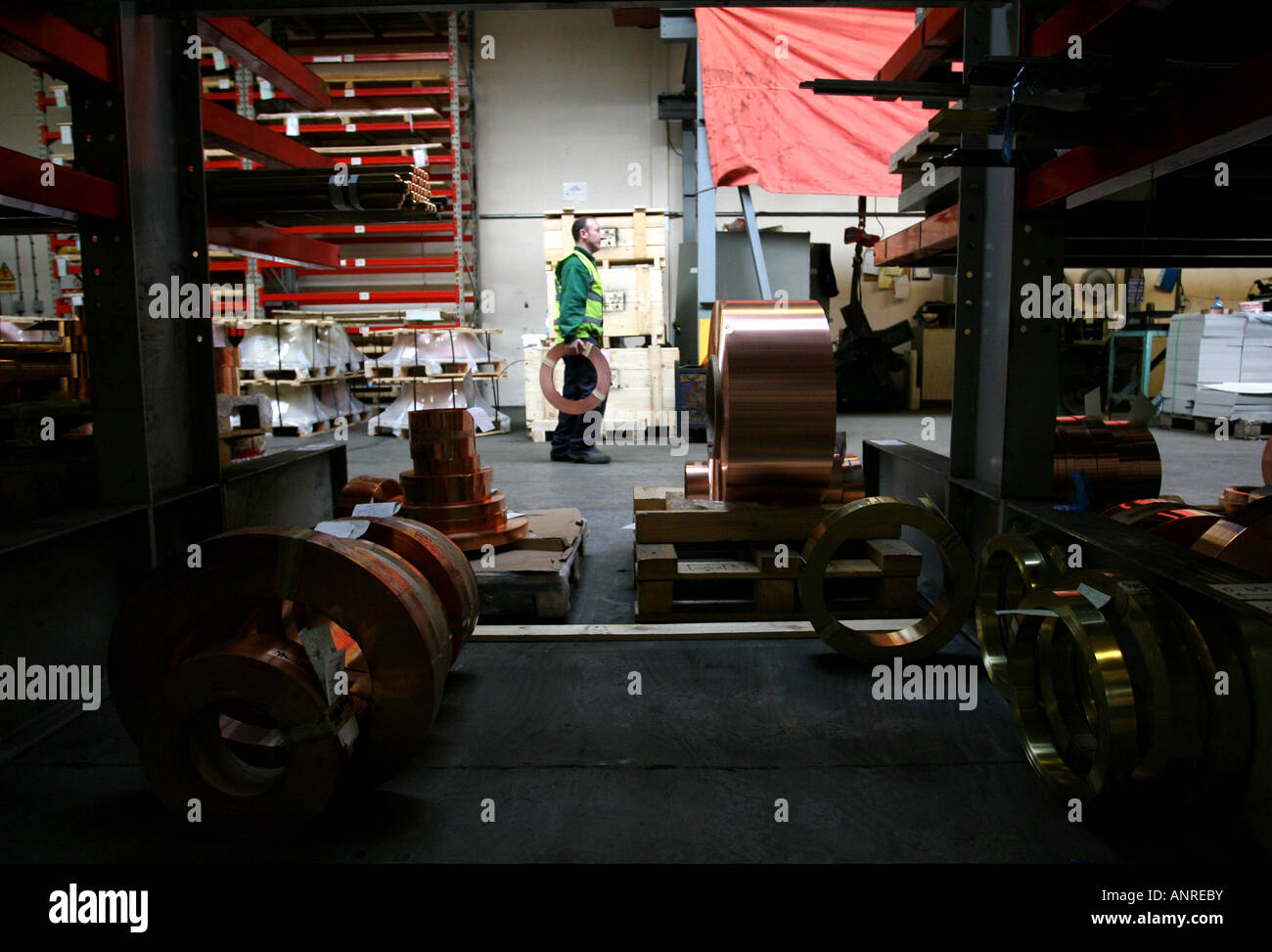A worker carrying Copper Stripping Coil in a copper distribution centre ...