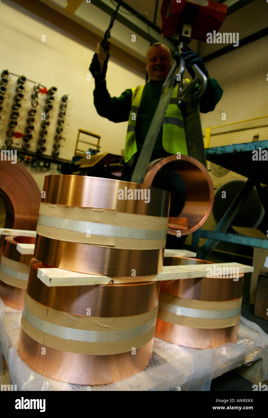 A worker carrying Copper Stripping Coil in a copper distribution centre ...