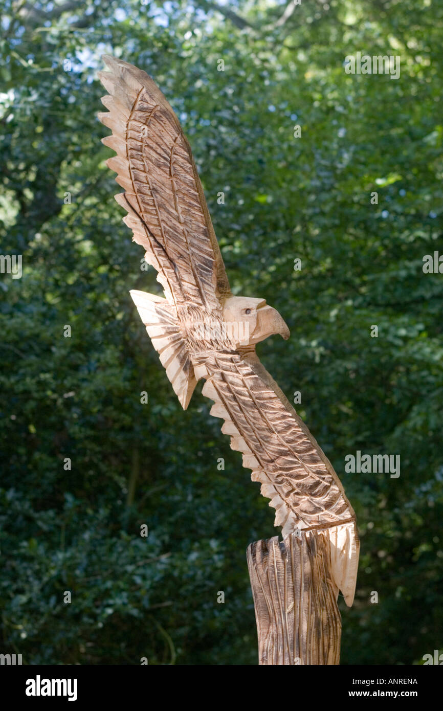 Eagle carved from tree trunks at country fair Stock Photo - Alamy