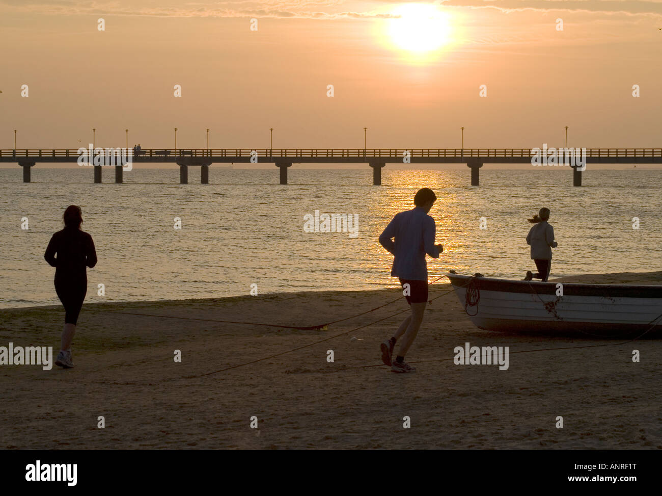 men jogging on the beach Stock Photo - Alamy