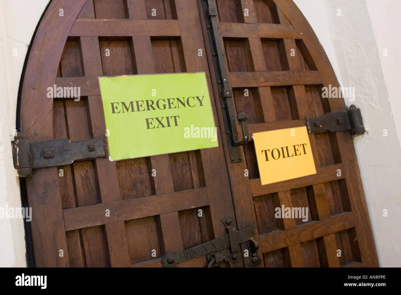 Emergency exit and toilet signs on door st marys church hi-res stock ...