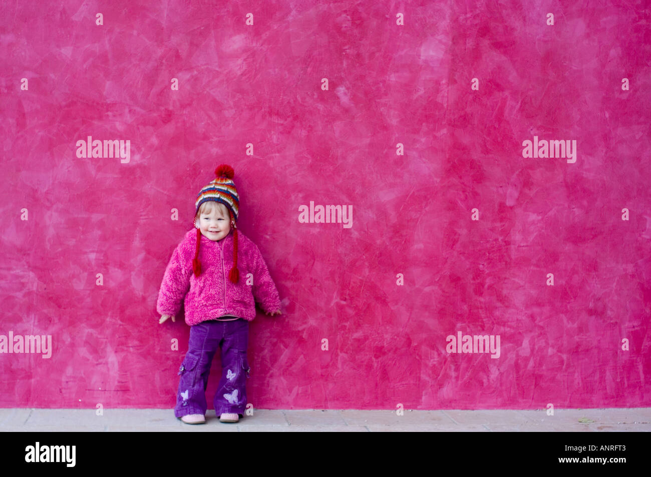 Child in pink Stock Photo - Alamy