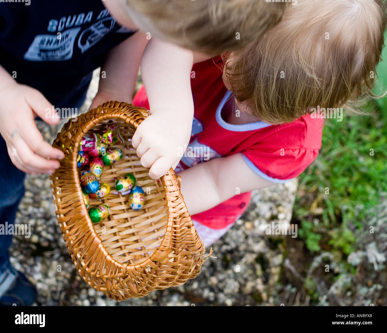 Hunting for easter eggs girl outdoors hi-res stock photography and ...