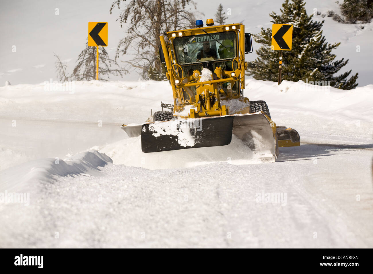 Snowplow removing snow Stock Photo - Alamy