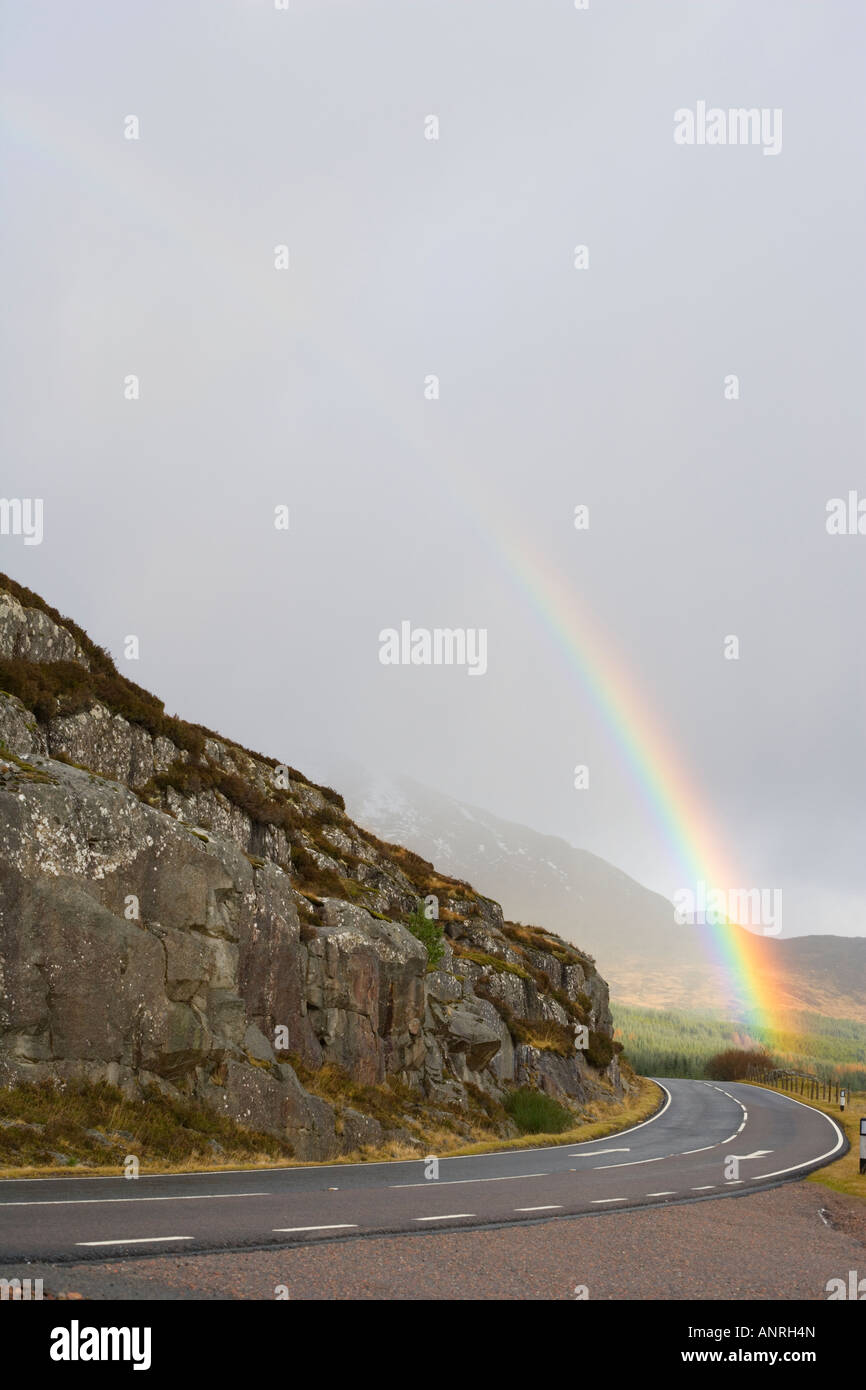 View at rainbow over A86 road from Loch Laggan Dam parking. Highlands ...