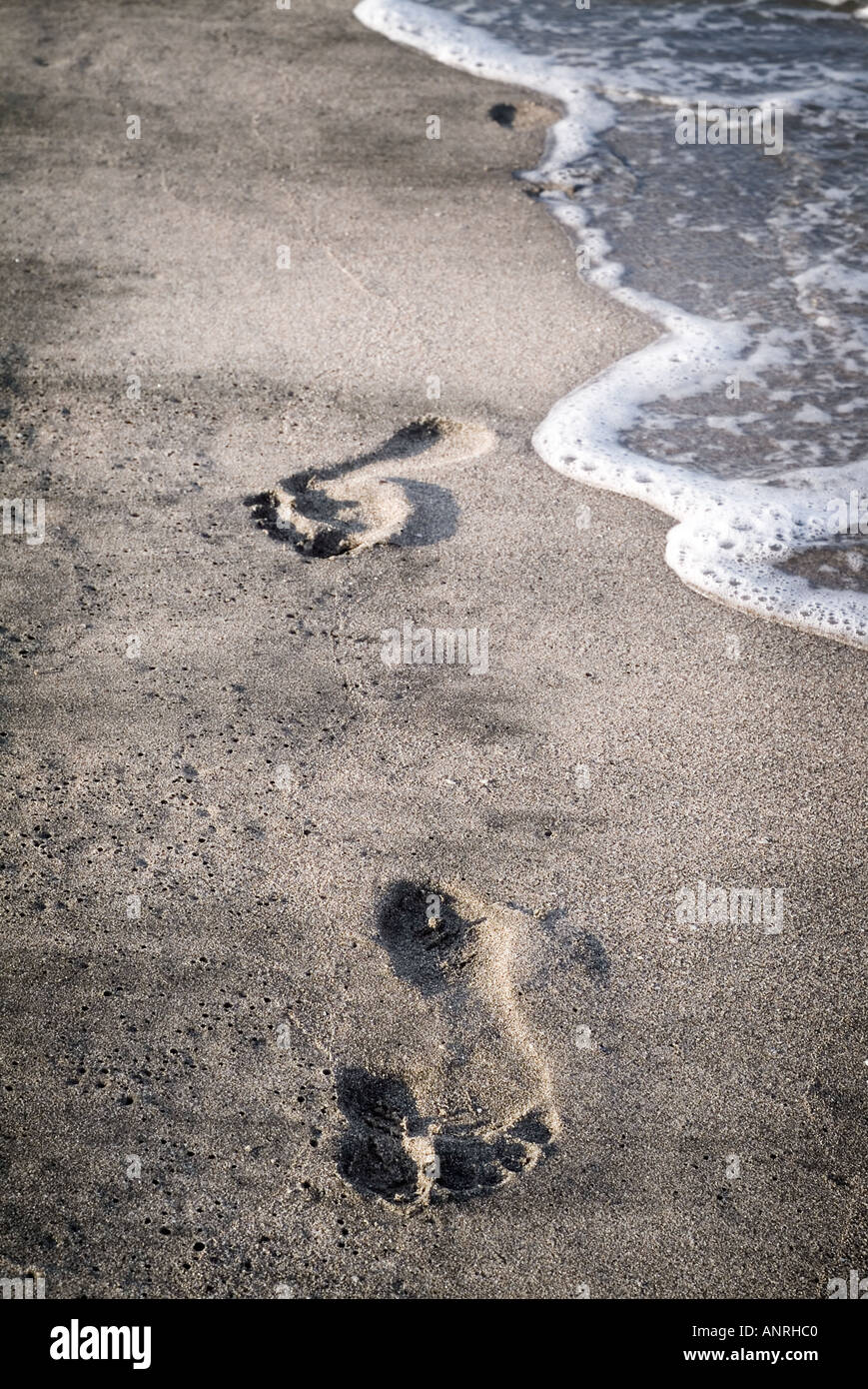 human steps on the sand Stock Photo - Alamy