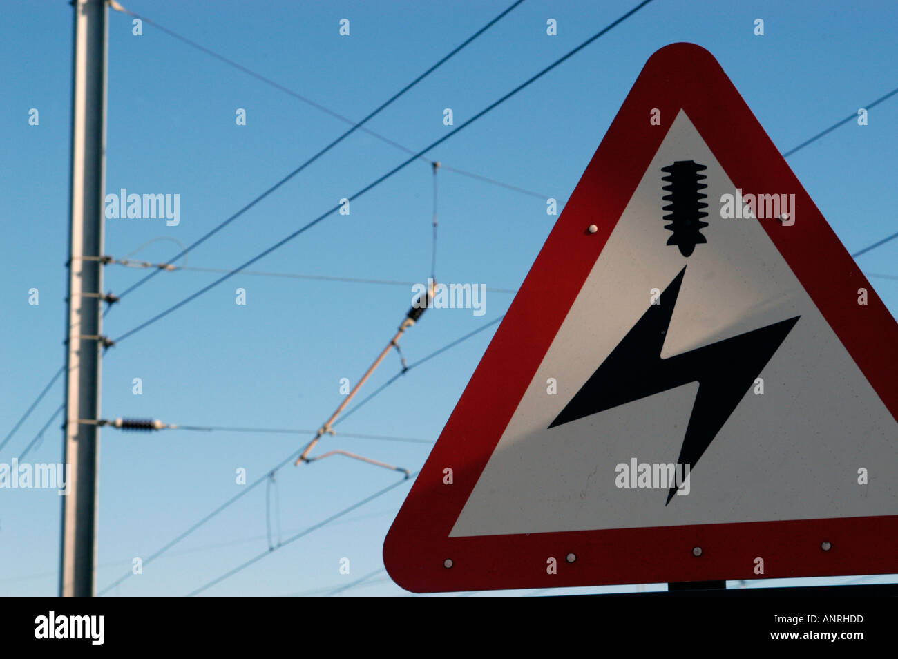 overhead power cable warning sign for trains with electricity lines in ...