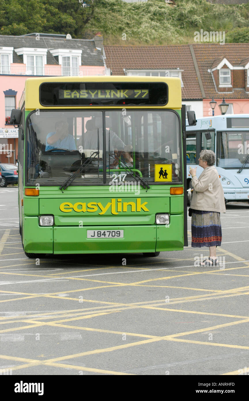 Local green bus picking up passengers at Gorey in Jersey Stock Photo ...