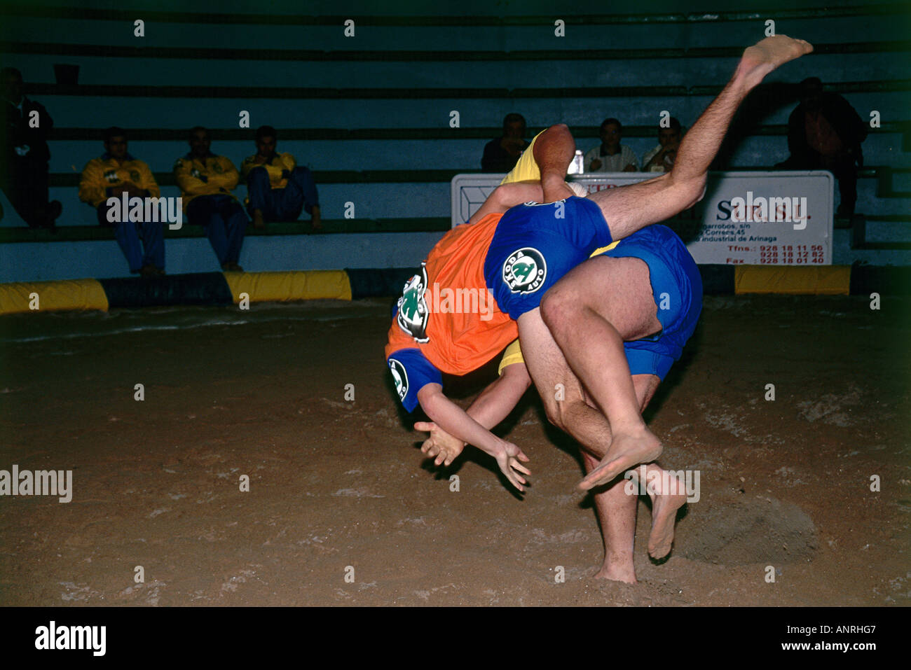 People participating in the traditional sport of Canarian wrestling ...