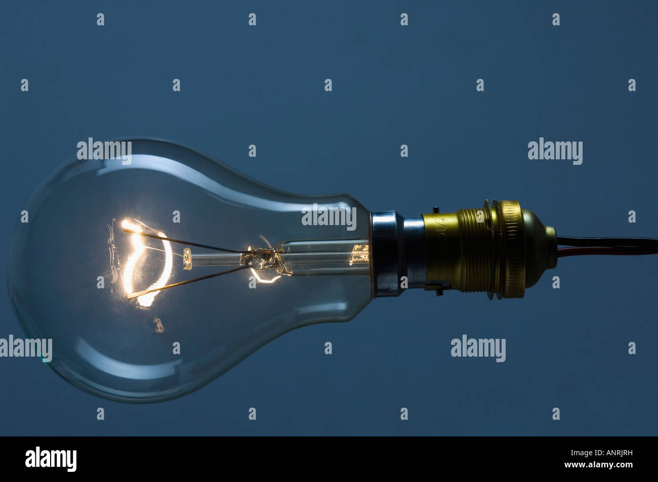 Close-up of the lit filament of a bulb Stock Photo - Alamy
