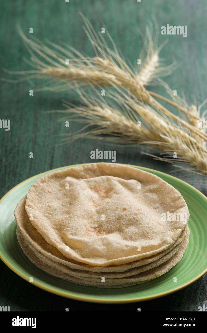 Close-up of chapattis in a plate with husk of wheat Stock Photo - Alamy