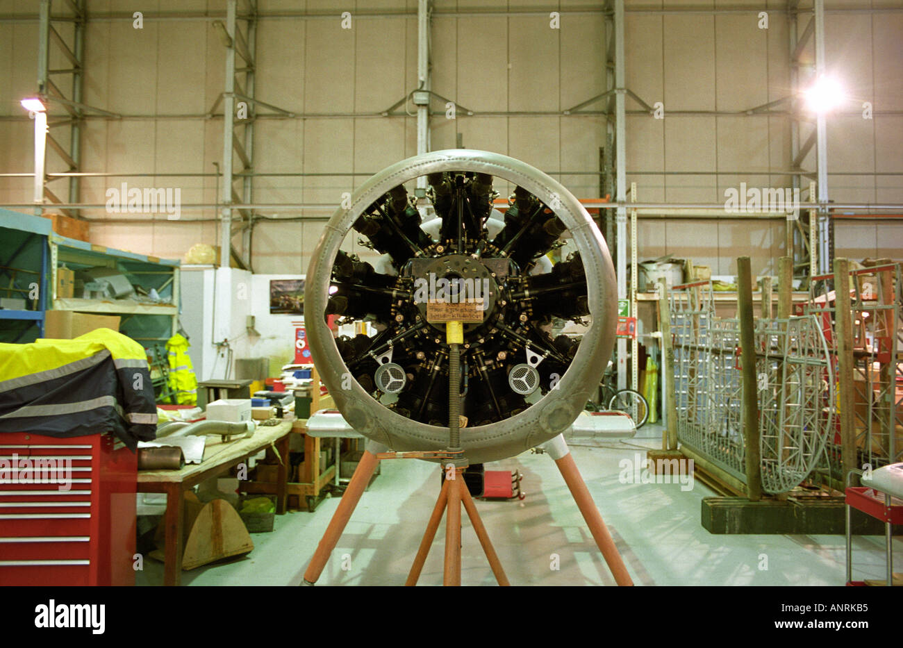 second world work fighter plane engine being repaired in workshop ...