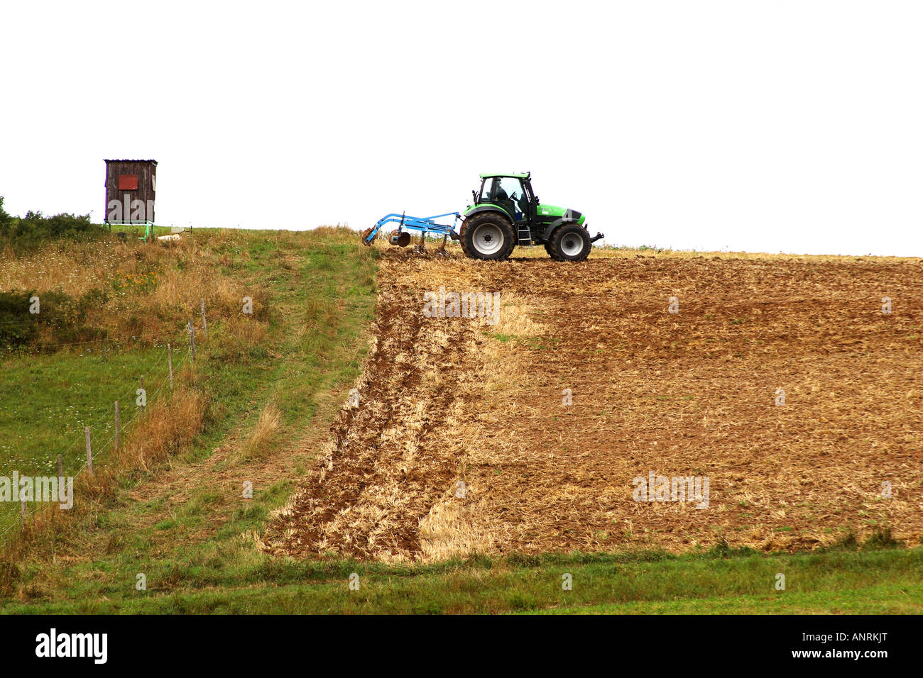 Tractor on the field Stock Photo - Alamy