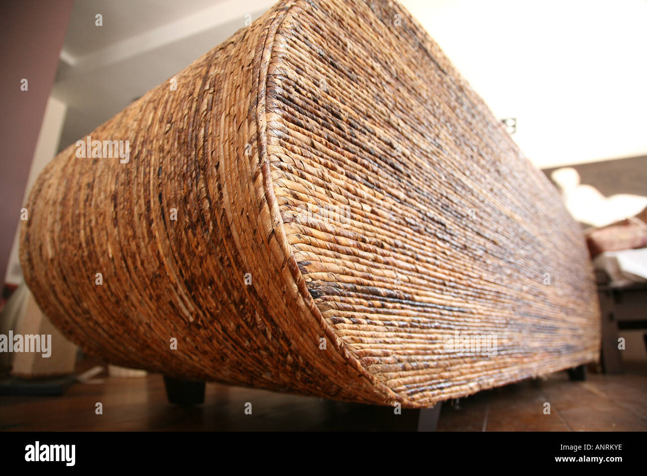 A whicker chair in a room Stock Photo - Alamy