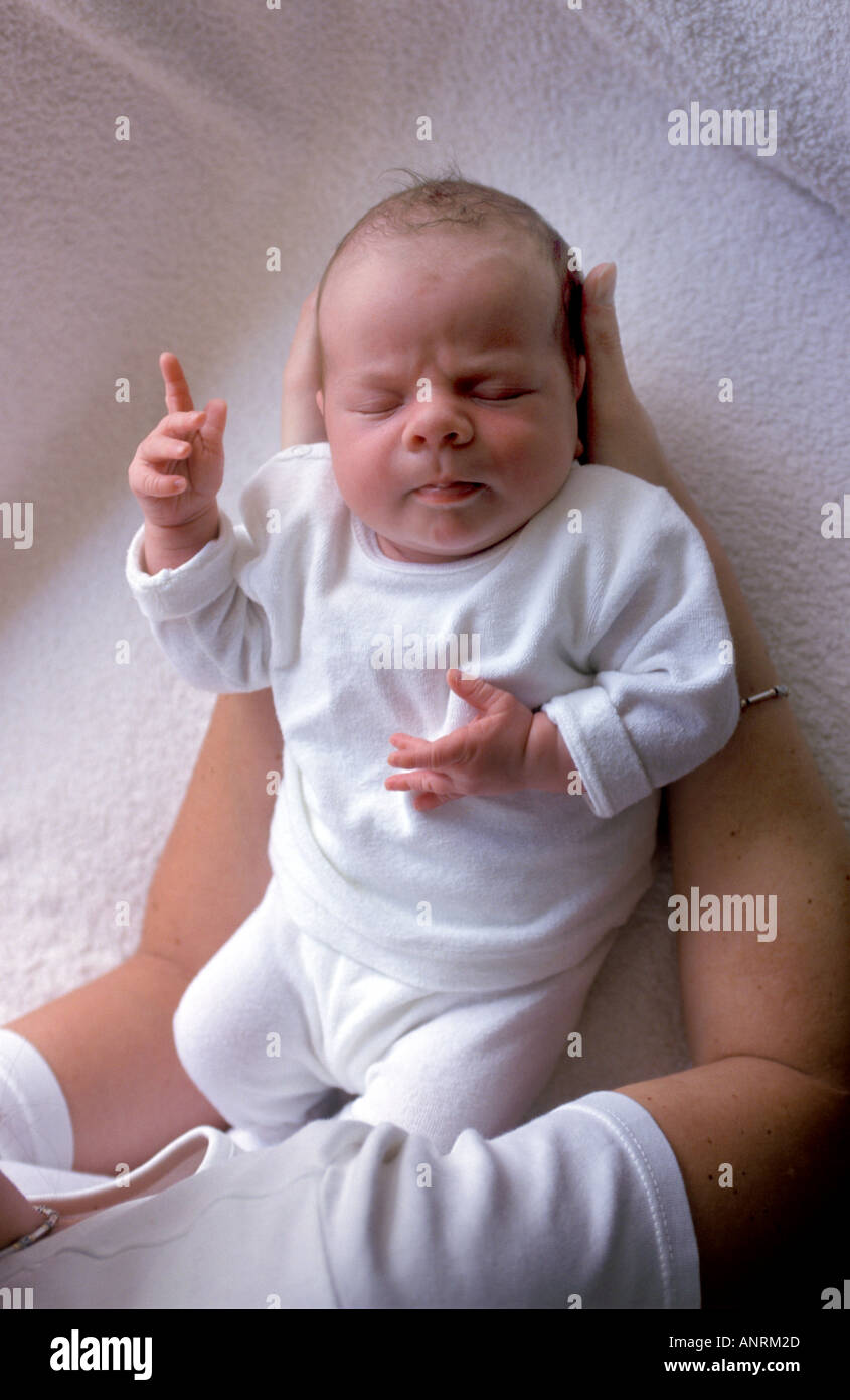 Newborn with a disturbed expression Stock Photo - Alamy