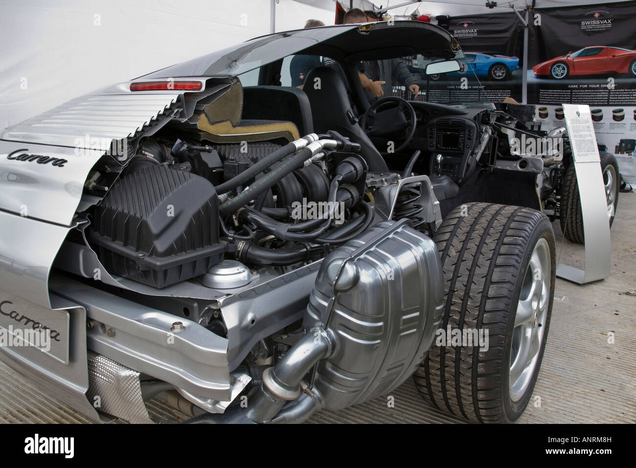 A Porsche 911 Carrera sliced in half to show the internal structure at ...