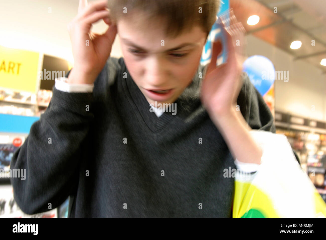 a seventeen year old youth with autism ‘twiddles’. Continually touching ...