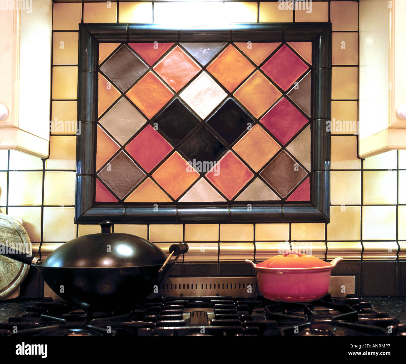 Tiling arrangement behind kitchen cooker - London Stock Photo - Alamy