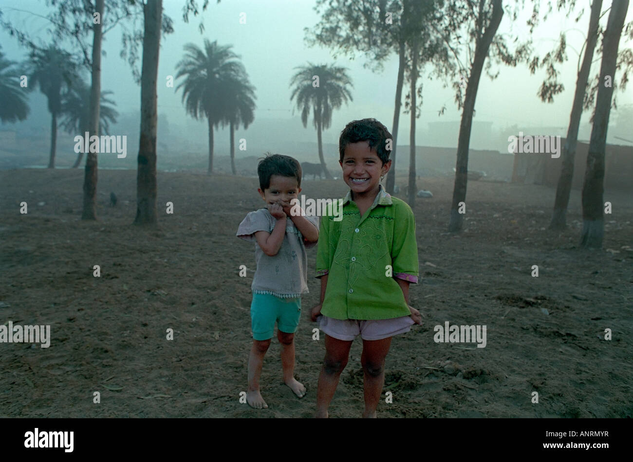 Two shy, smiling and friendly poor boys on India Stock Photo - Alamy