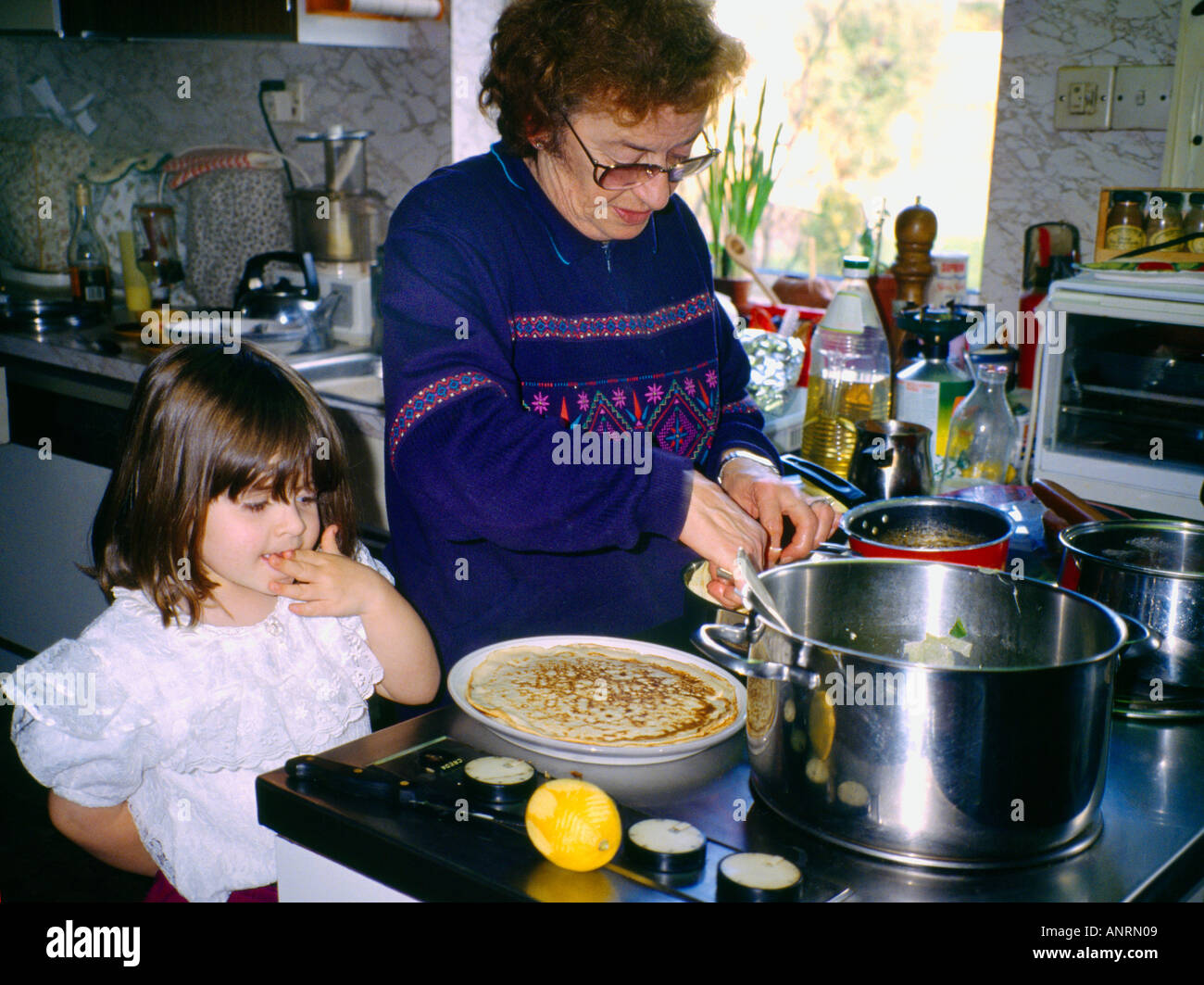 Child helping grandmother in hi-res stock photography and images - Alamy