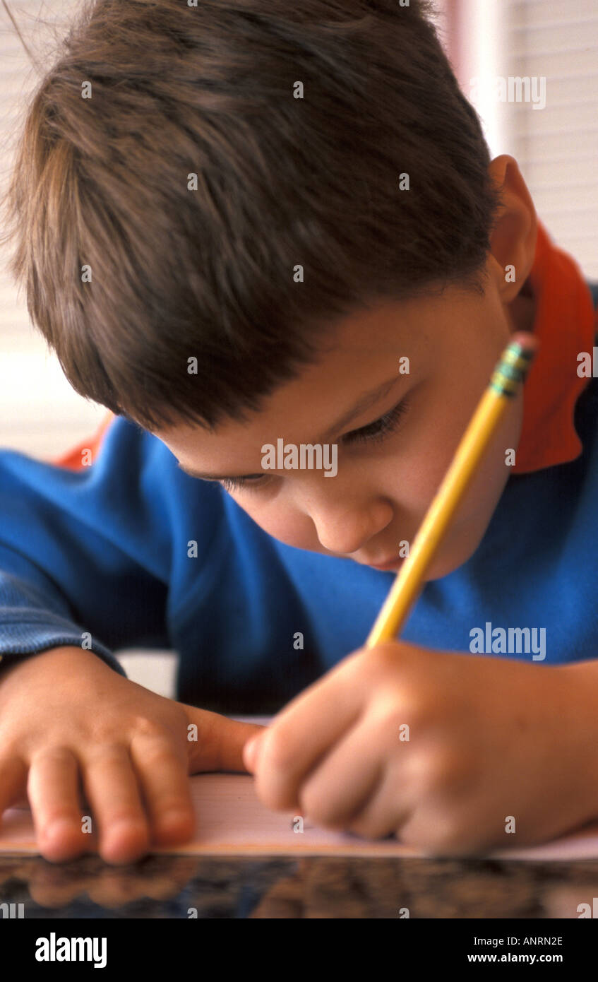 Boy is making his homework Stock Photo - Alamy