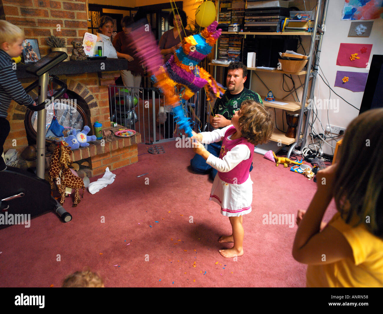 Hitting pinata birthday party hi-res stock photography and images - Alamy