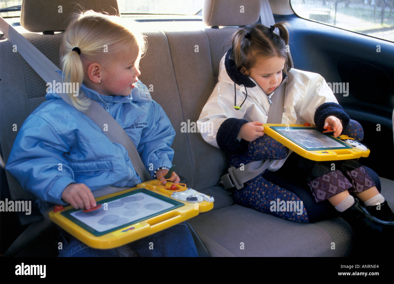 Two children in back seat hi-res stock photography and images - Alamy
