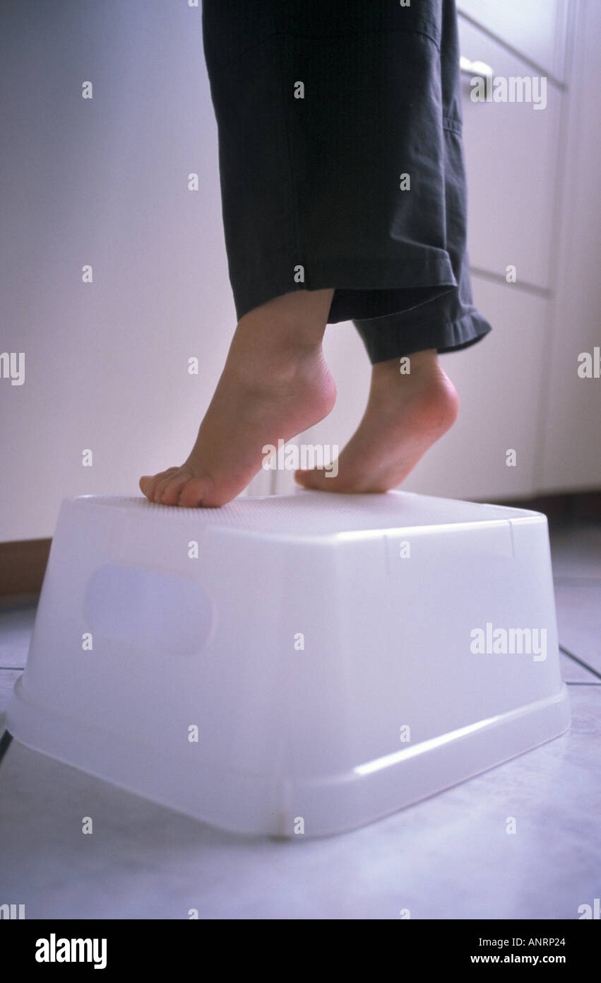 Child standing on his her toes Stock Photo - Alamy